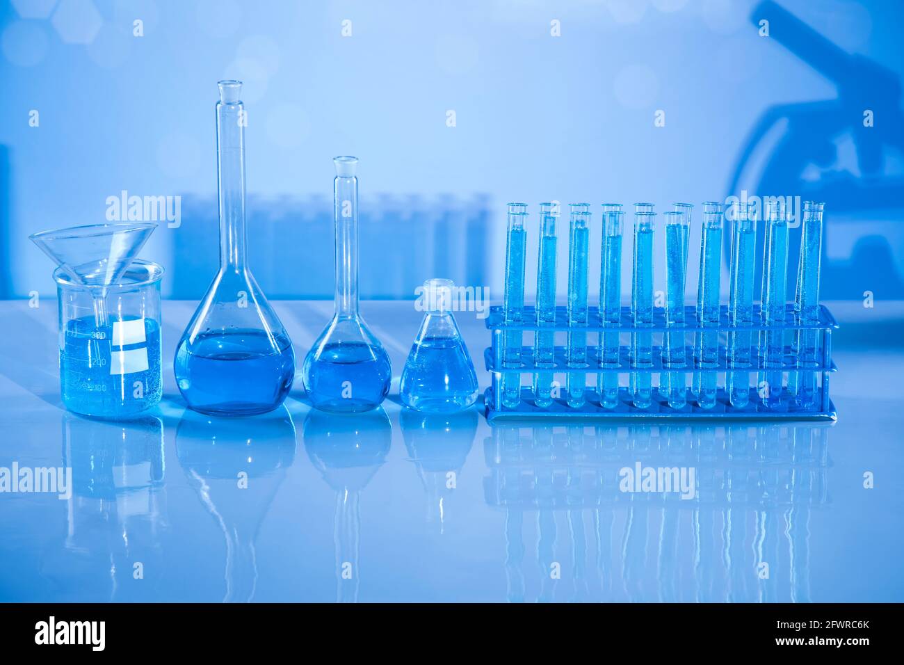 Laboratory equipment, glass filled background Stock Photo - Alamy