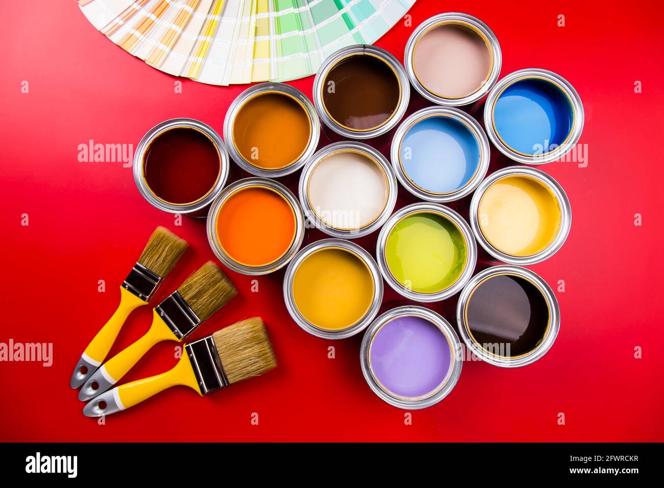 Tin cans with paint, brushes and bright palette of colors Stock Photo ...