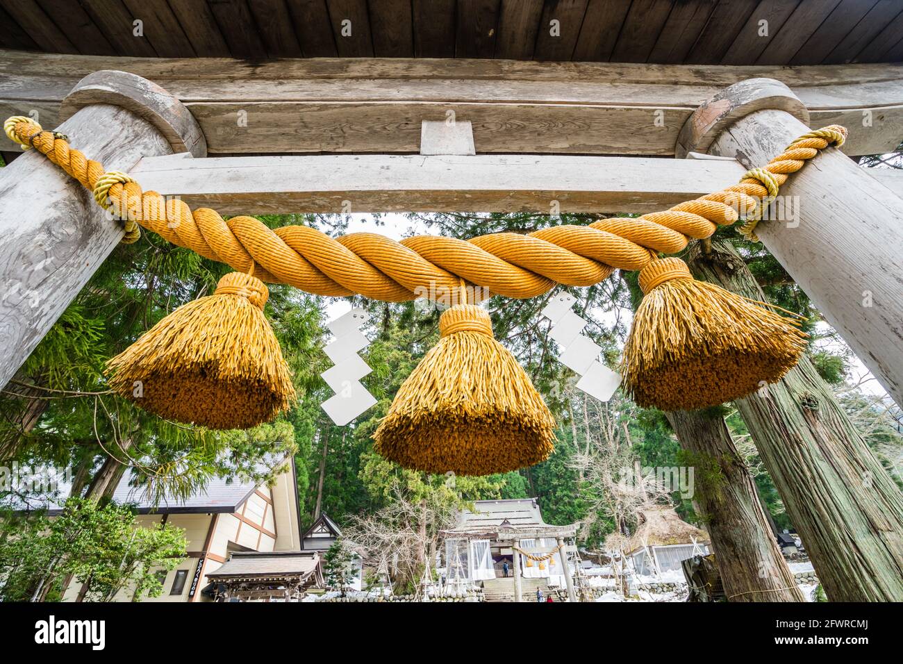 Low angle of the golden colored traditional rope hanging from the ...
