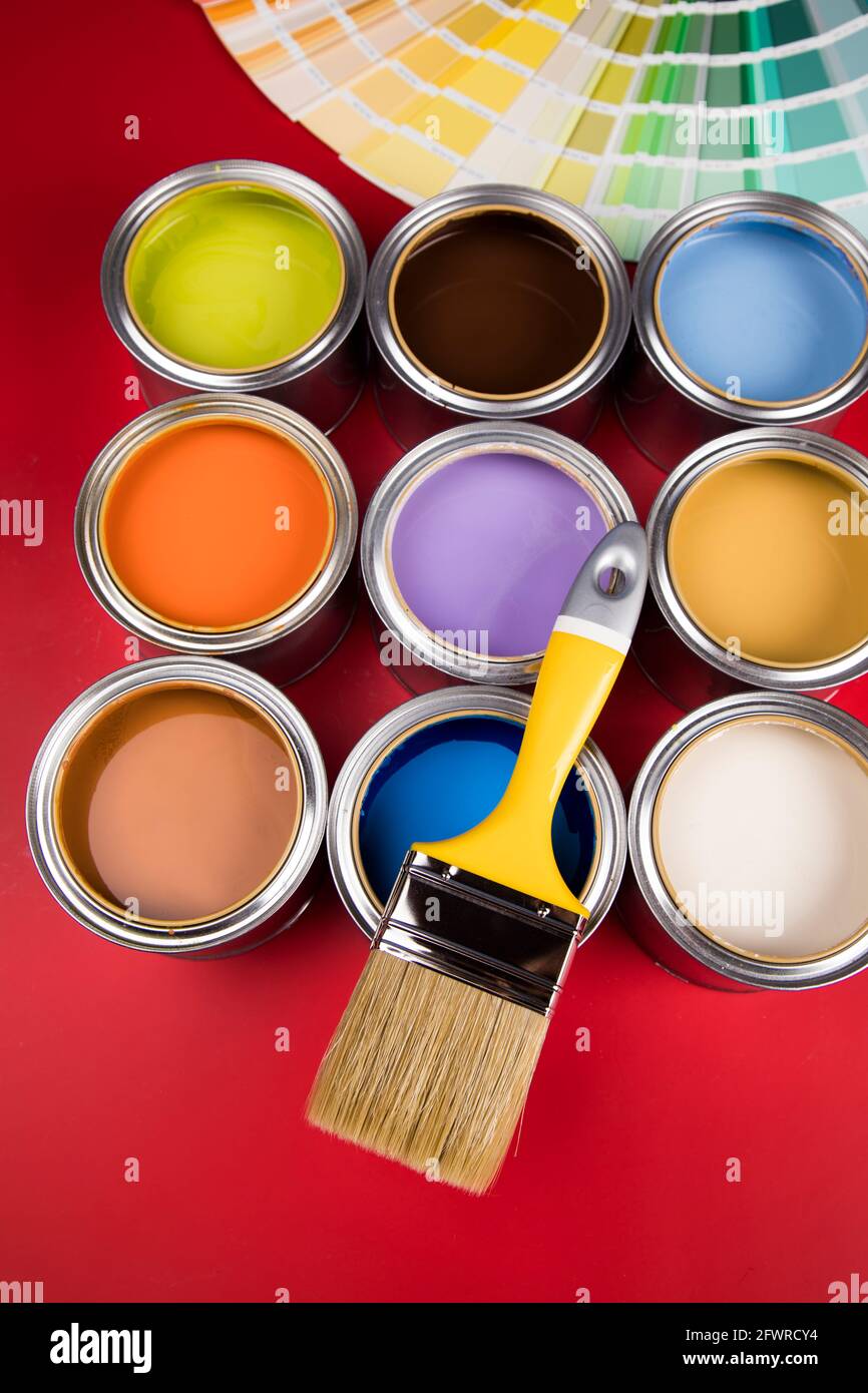 Paint brush, tin can and color guide samples Stock Photo - Alamy