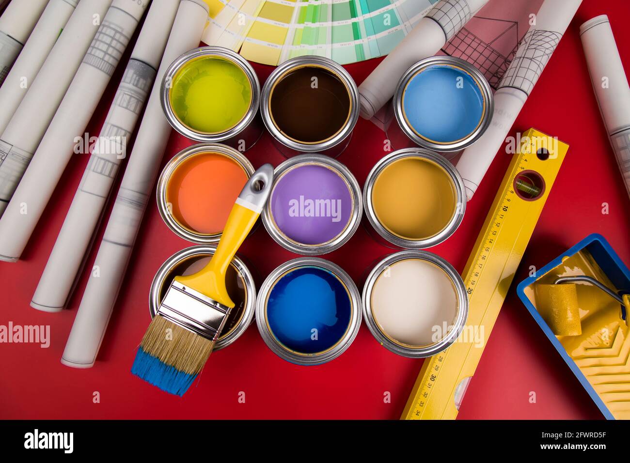 Paint brush, tin can and color guide samples Stock Photo - Alamy