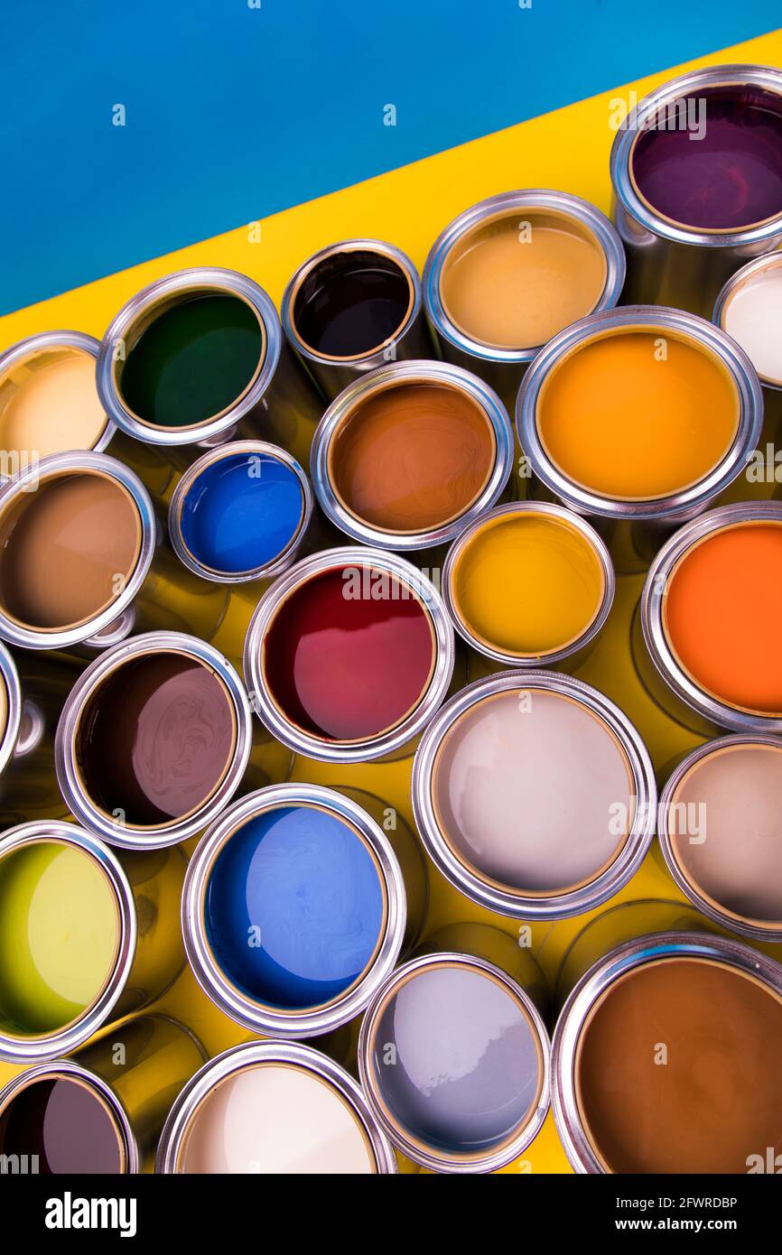 Group of tin metal cans with color paint Stock Photo - Alamy