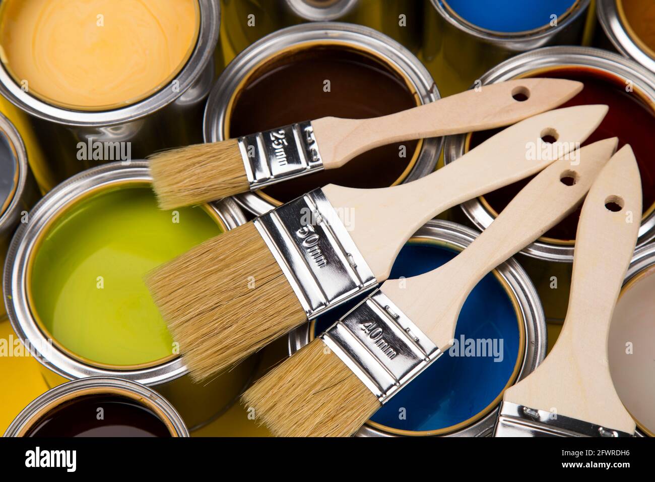 Tin cans with paint, brushes and bright palette of colors Stock Photo ...