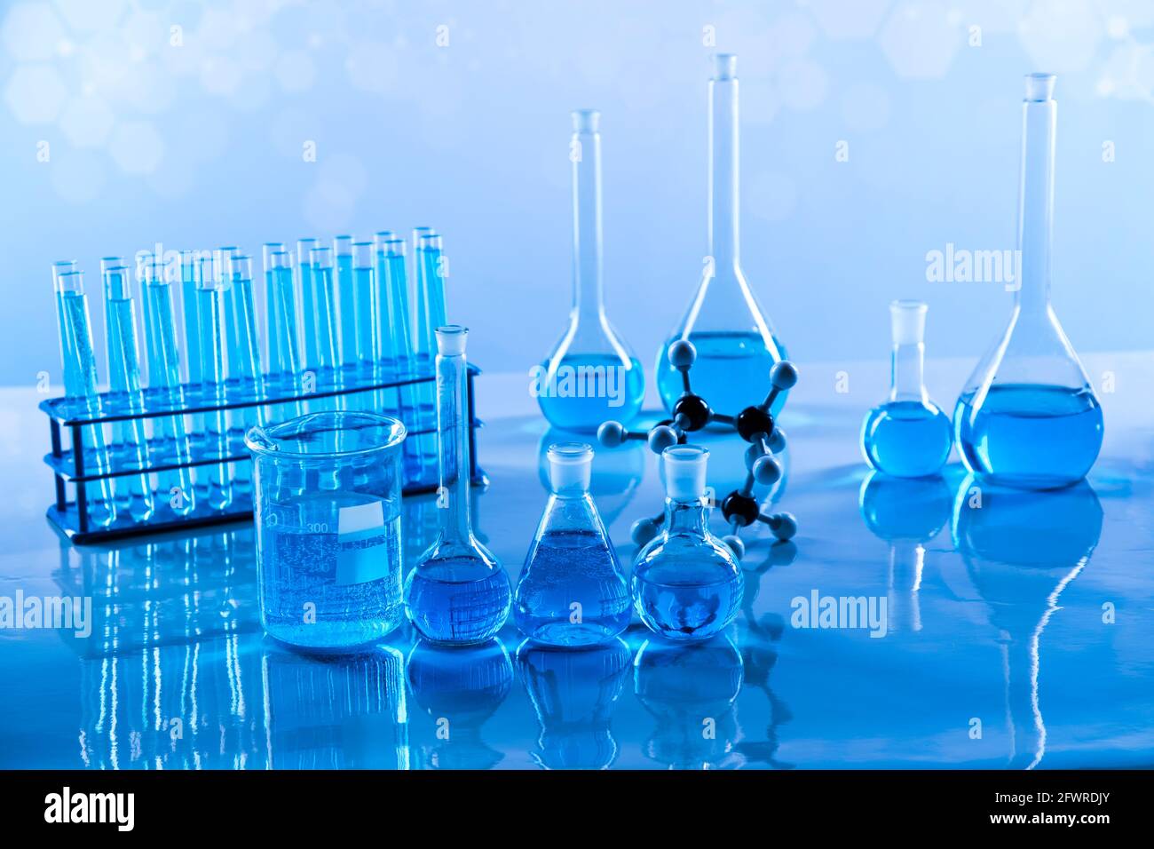 Laboratory beakers,Science experiment, blue background Stock Photo - Alamy