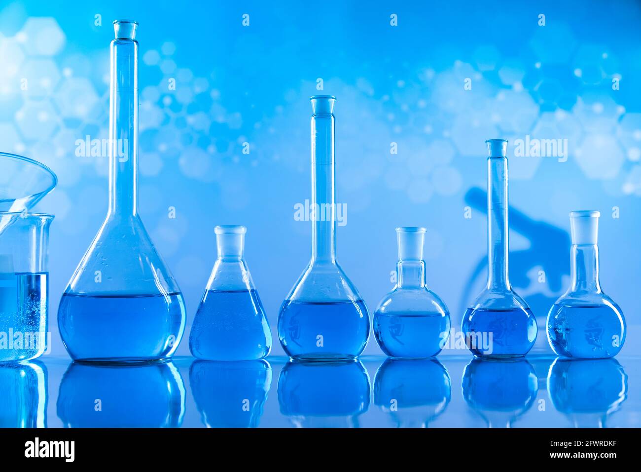 Laboratory equipment, glass filled background Stock Photo - Alamy