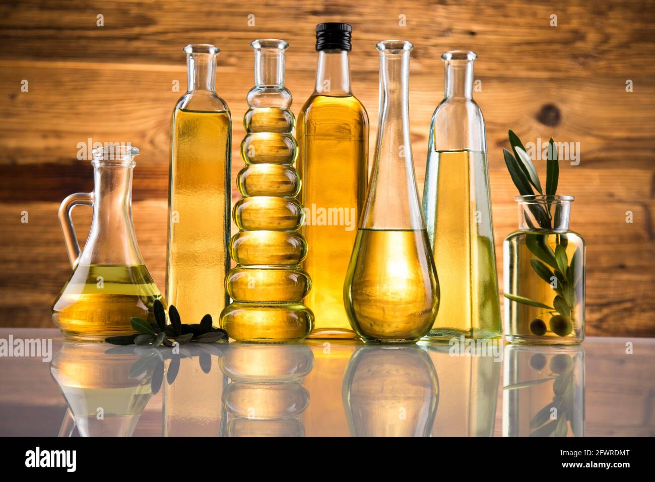 Bottles of olive oil, olive branch and Cooking oils Stock Photo - Alamy