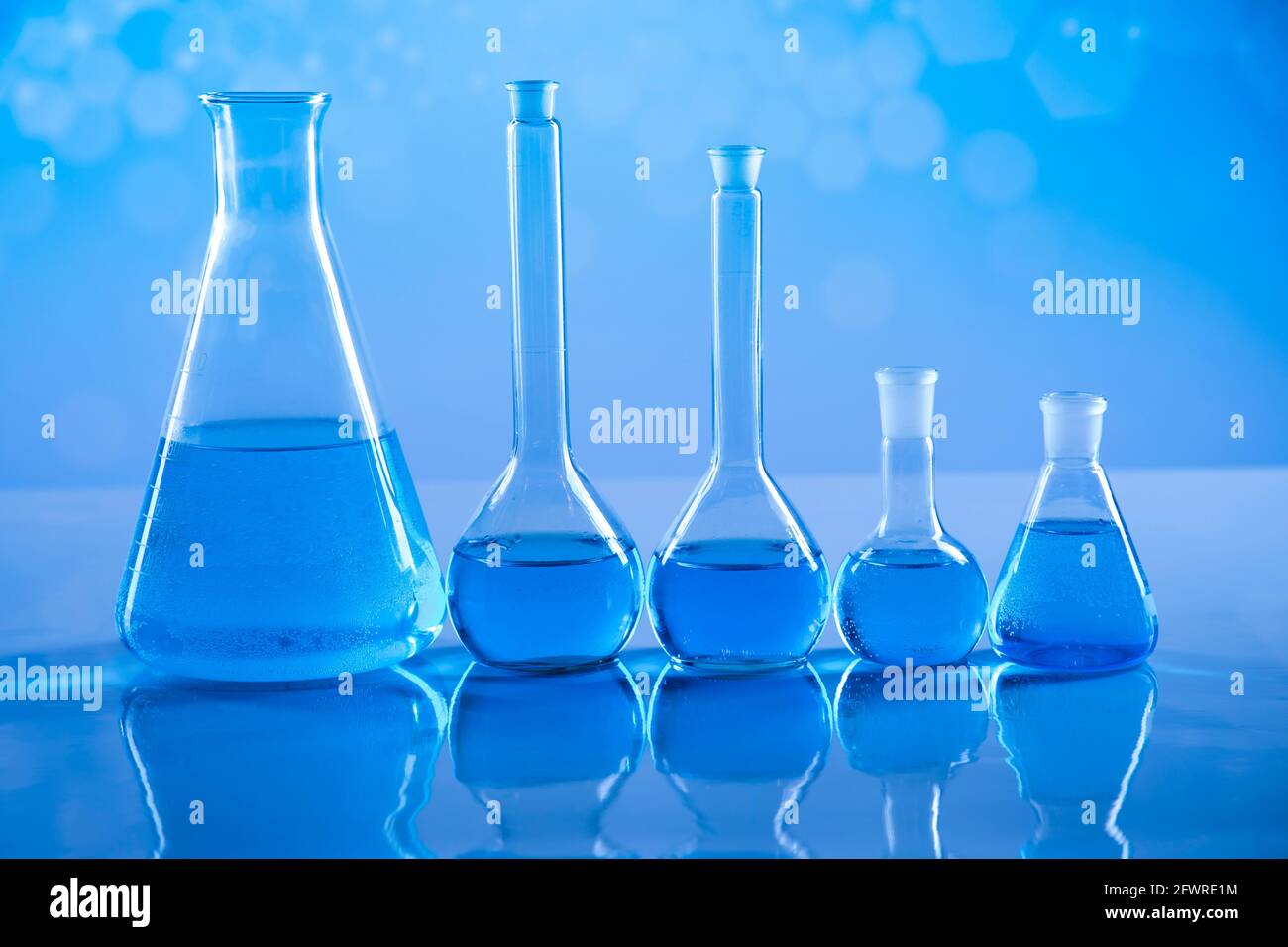Laboratory equipment, glass filled background Stock Photo - Alamy