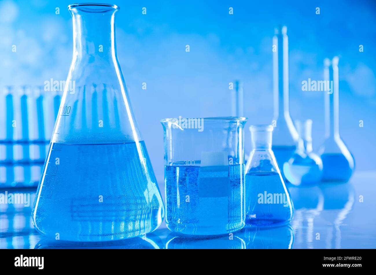 Laboratory equipment, glass filled background Stock Photo - Alamy