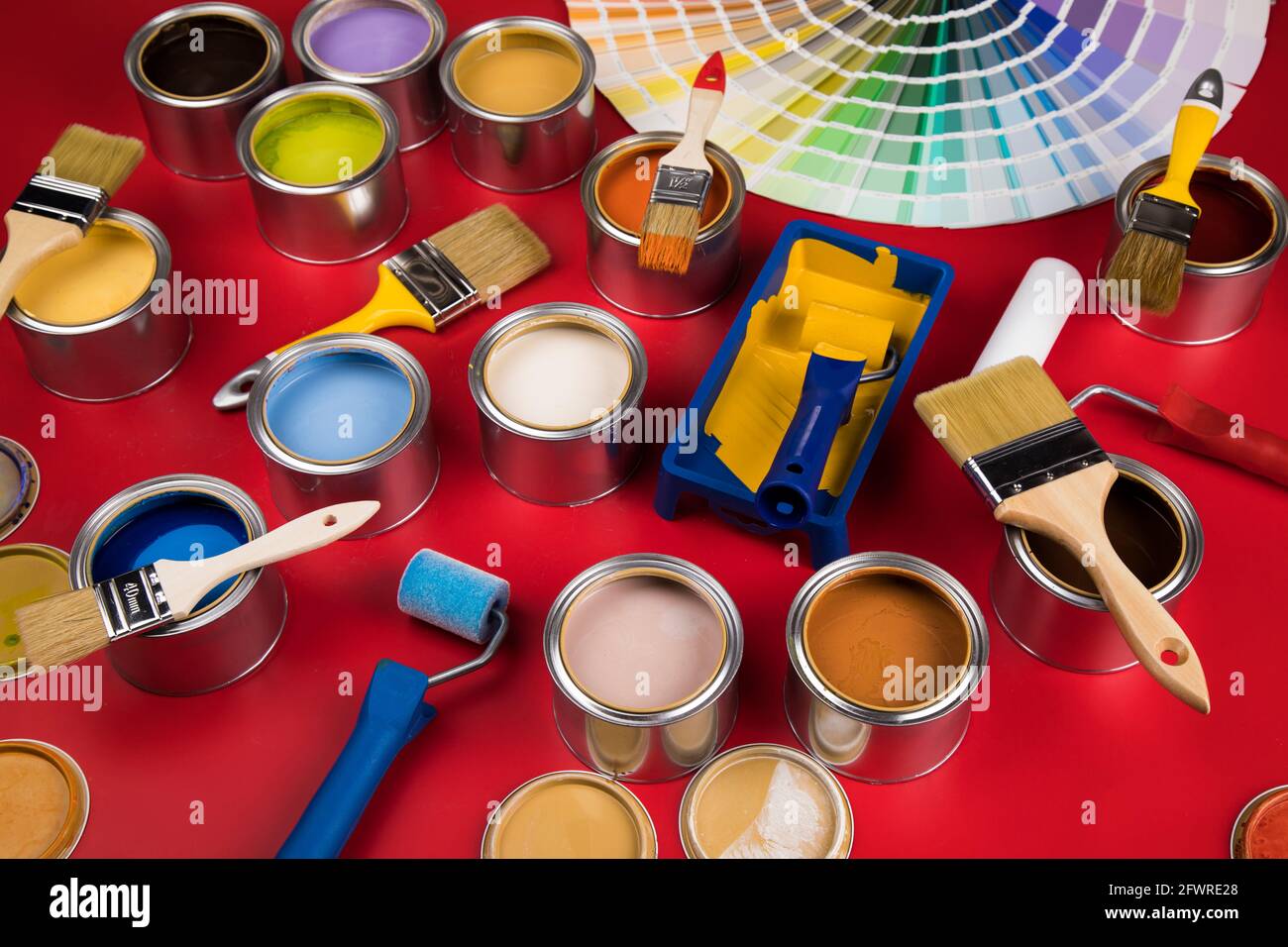 Paint brush, tin can and color guide samples Stock Photo - Alamy