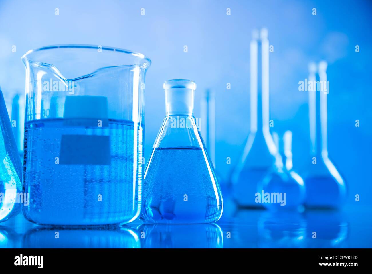 Laboratory equipment, glass filled background Stock Photo - Alamy