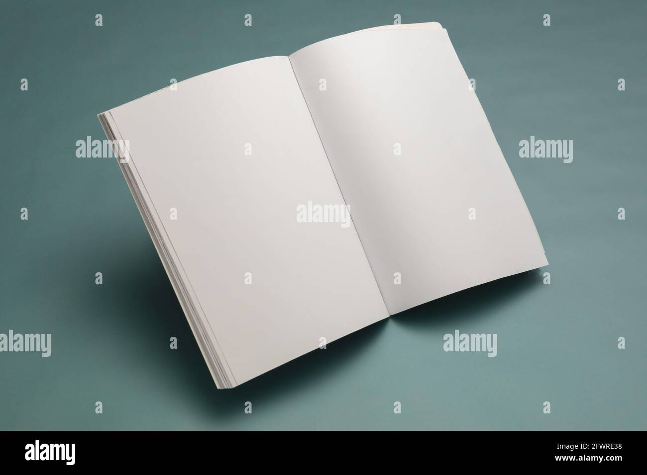 Composition of opened book with blank pages on blue background Stock ...