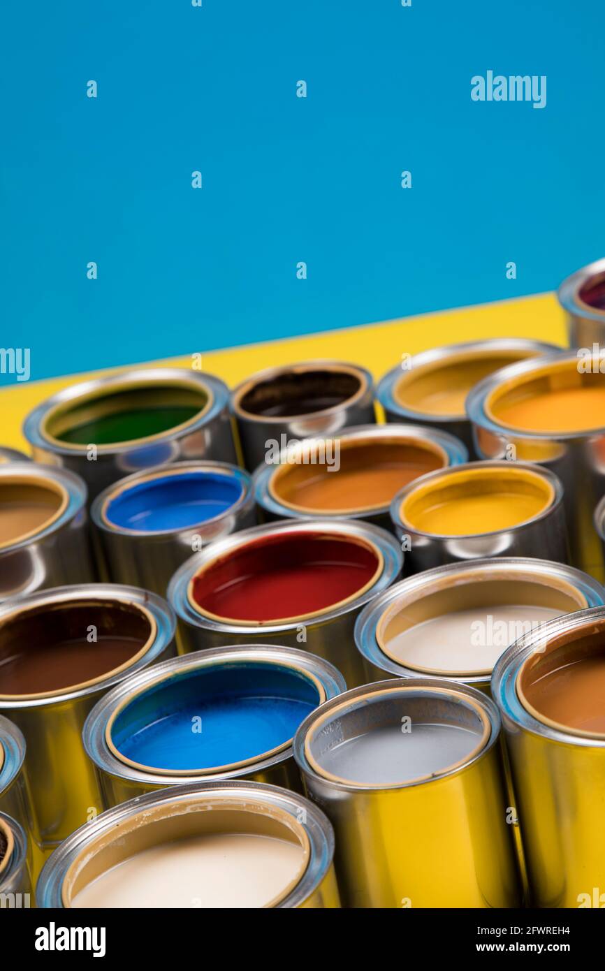 Group of tin metal cans with color paint Stock Photo - Alamy