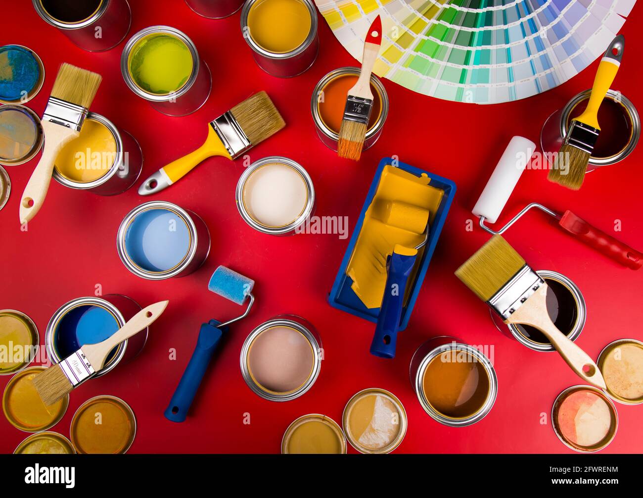 Paint brush, tin can and color guide samples Stock Photo - Alamy