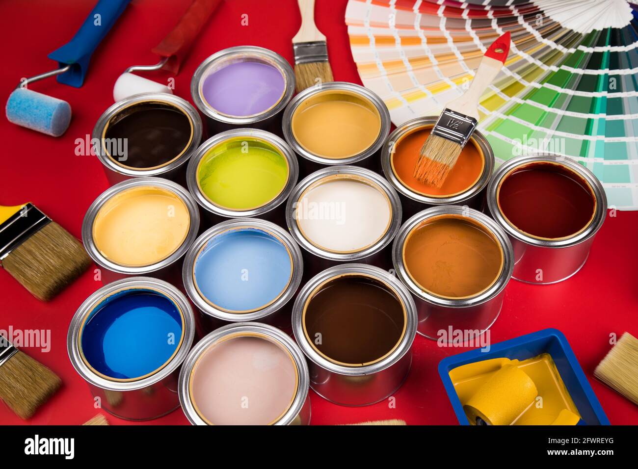 Paint brush, tin can and color guide samples Stock Photo - Alamy