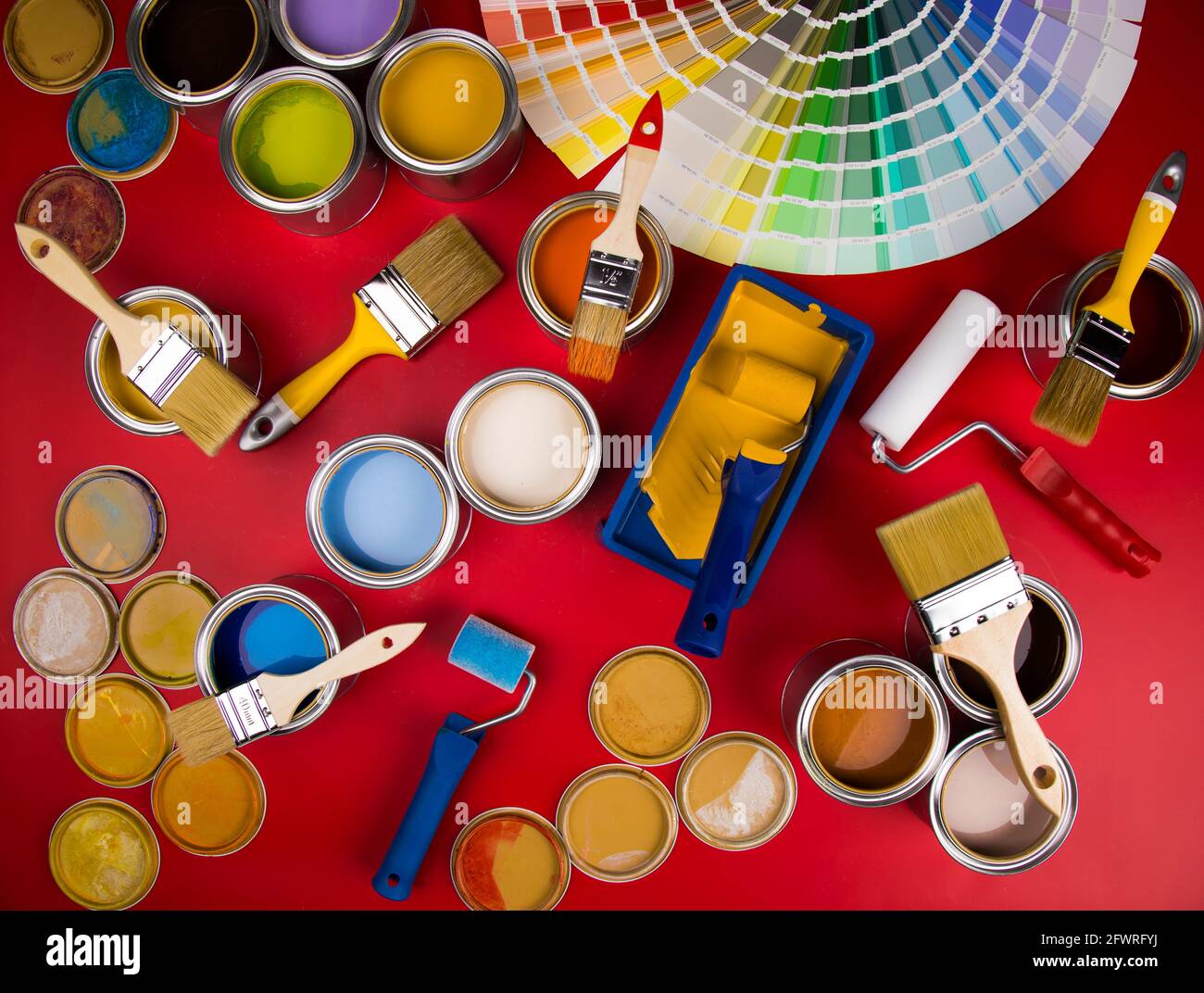 Paint brush, tin can and color guide samples Stock Photo - Alamy