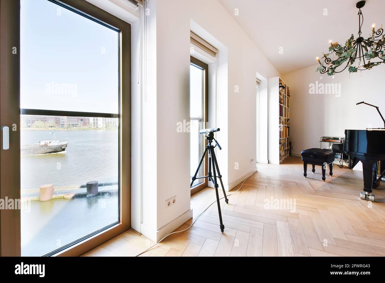 Modern house with panoramic windows viewing city channel furnished with ...