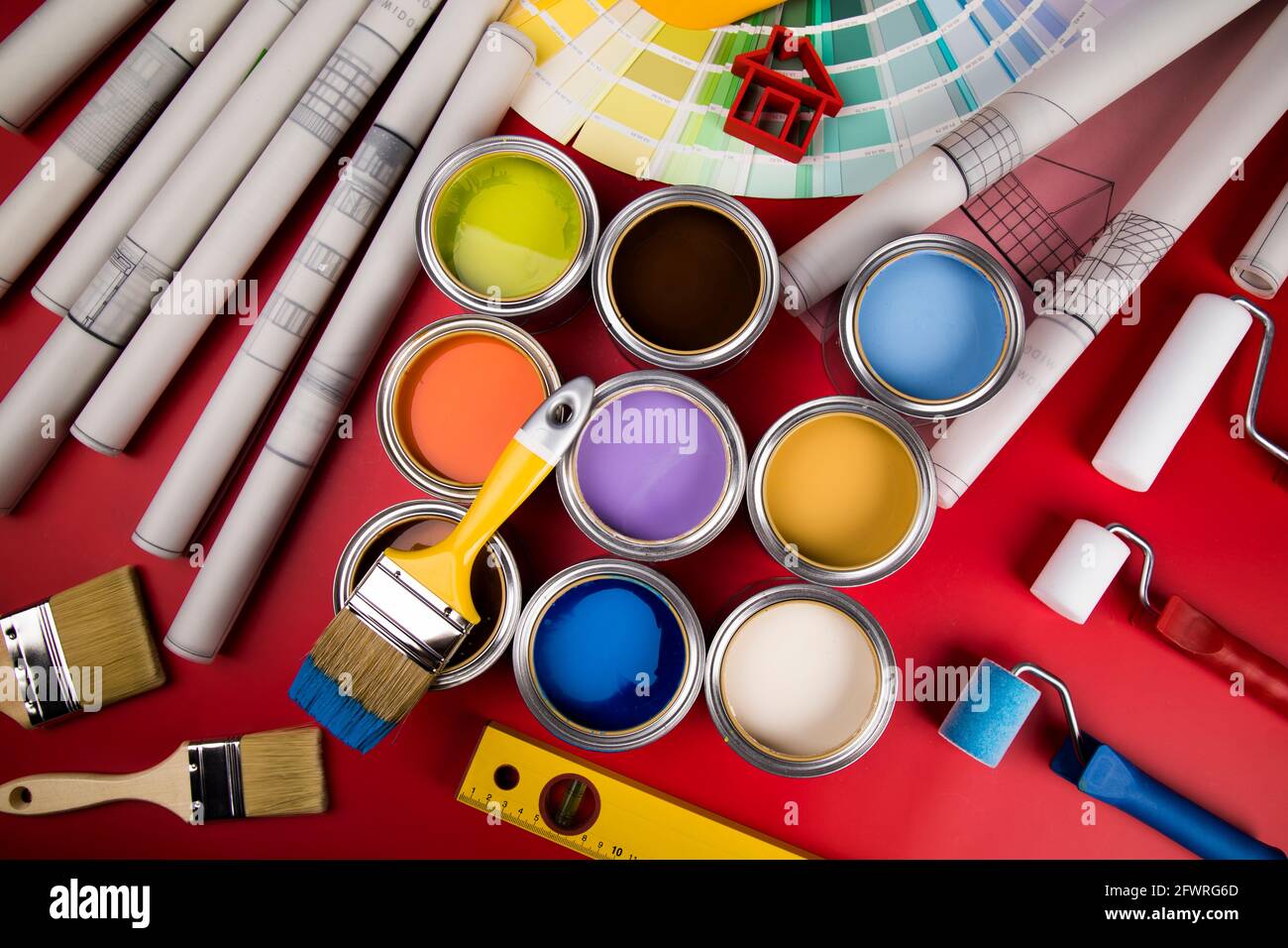 Paint brush, tin can and color guide samples Stock Photo - Alamy