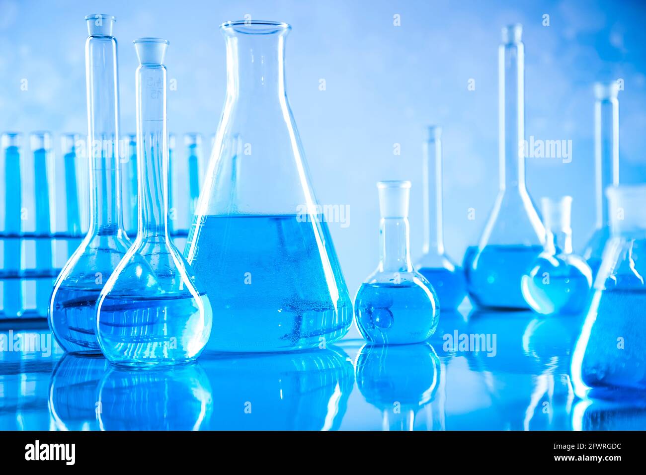 Laboratory equipment, glass filled background Stock Photo - Alamy
