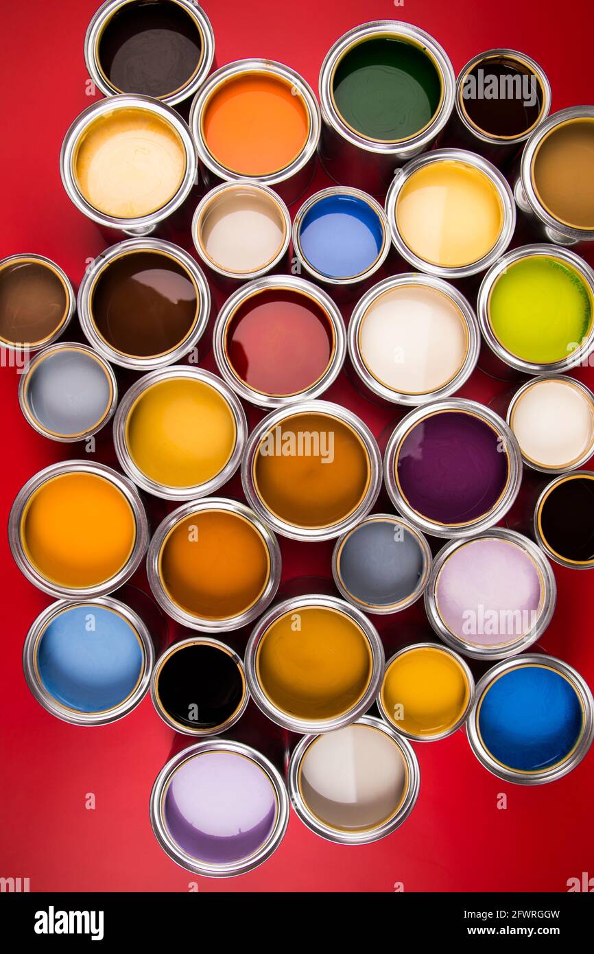 Group of tin metal cans with color paint Stock Photo - Alamy