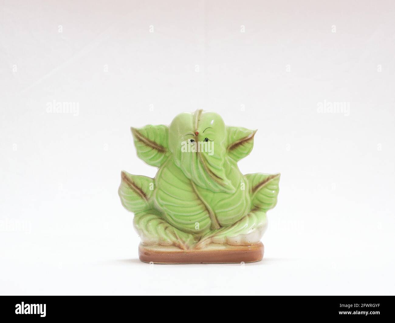 hindu god lord ganesh statue isolated in a white background Stock Photo ...