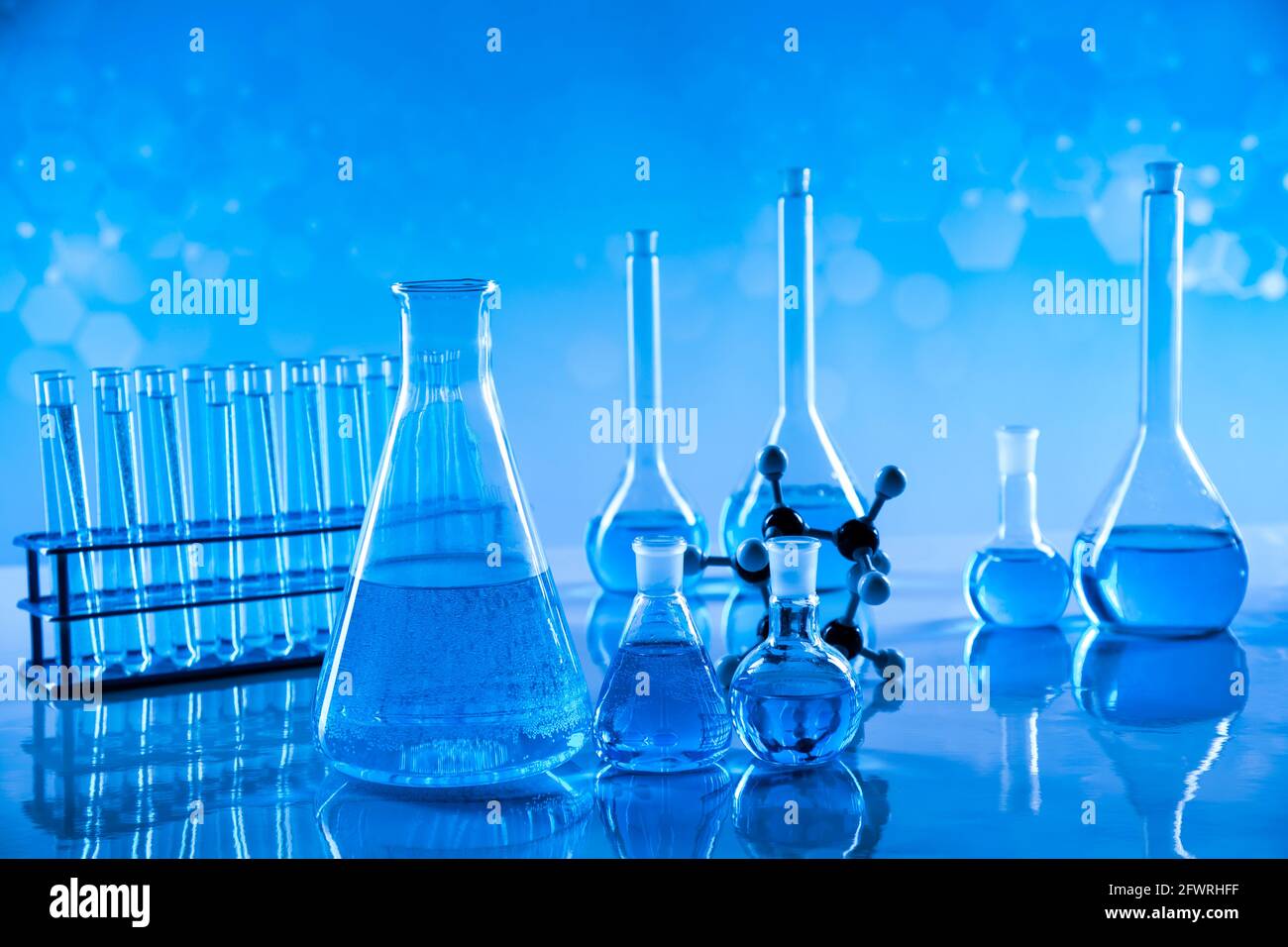 Laboratory beakers,Science experiment, blue background Stock Photo - Alamy