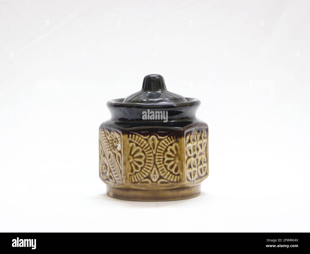 traditional antique jar used to store food isolated in a white ...