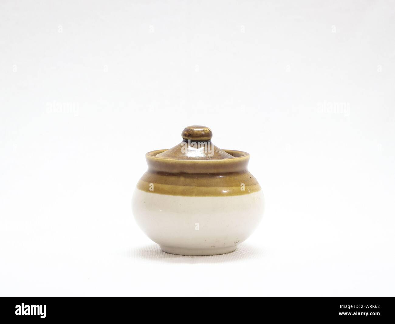 traditional antique jar used to store food isolated in a white ...