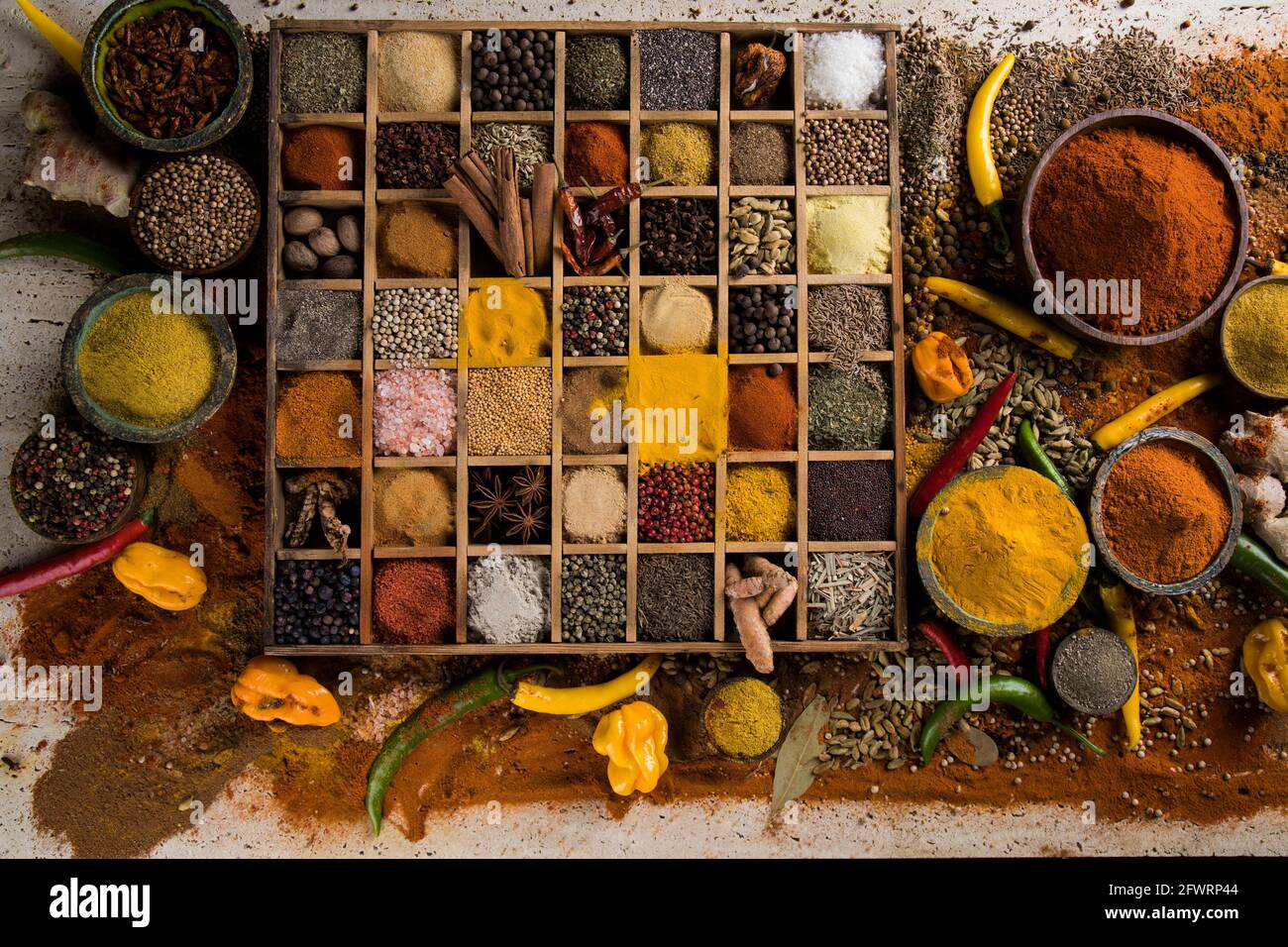 A selection of spices on stone background Stock Photo - Alamy