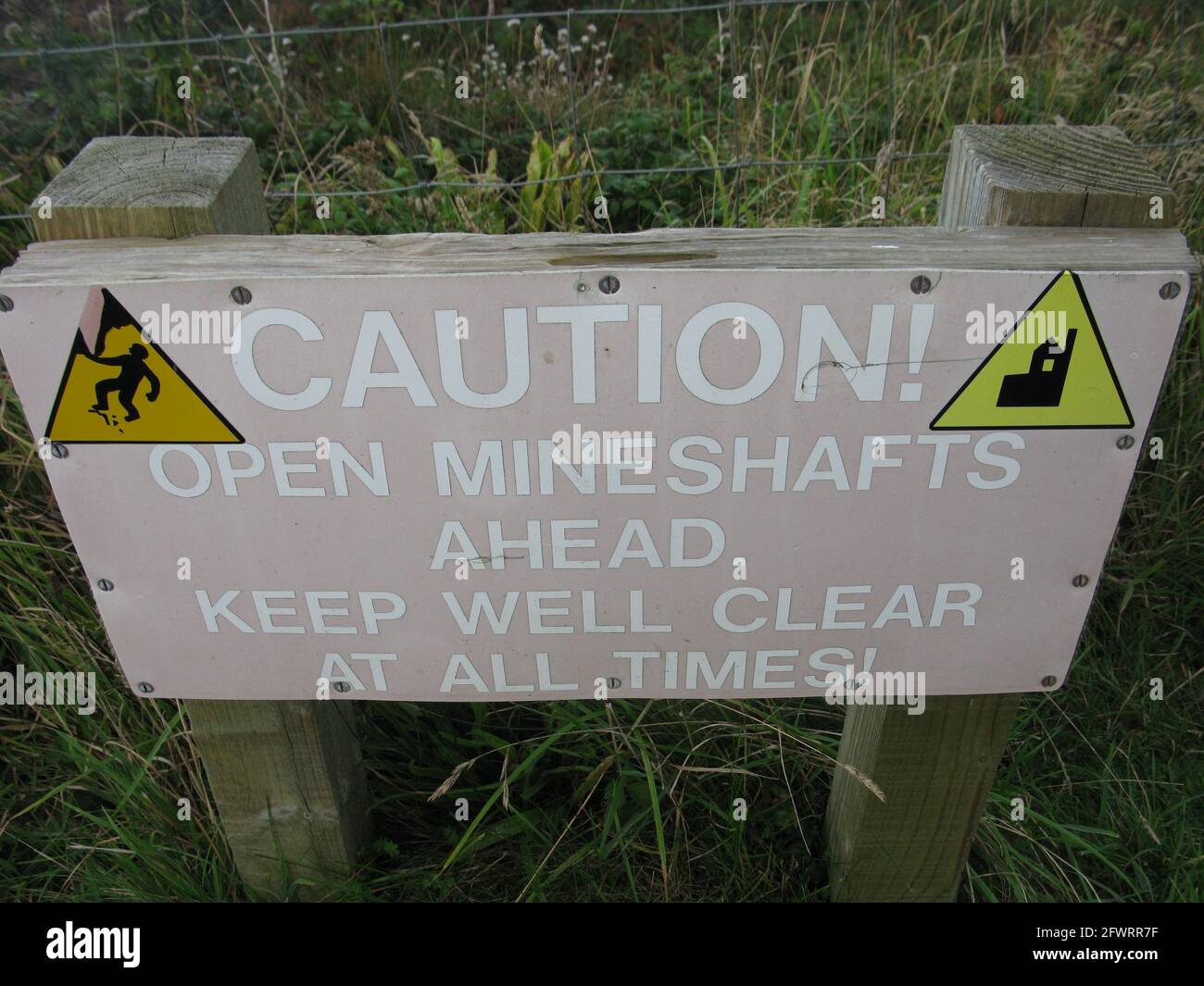 Caution open mines shafts ahead keep well clear sign. South west coast ...