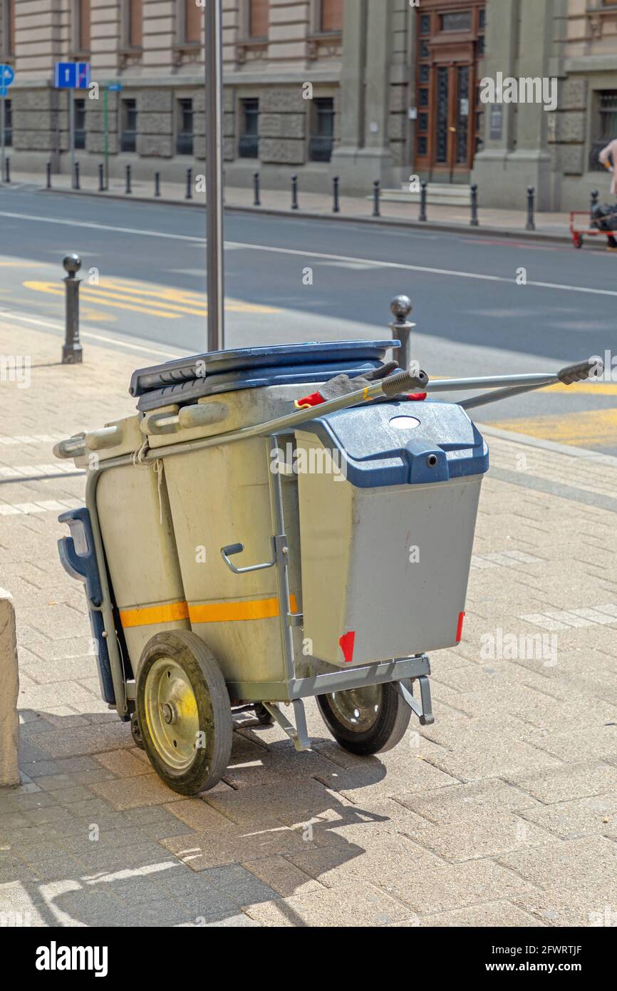 Street Cleaner Cart With Trash Bin in City Stock Photo - Alamy