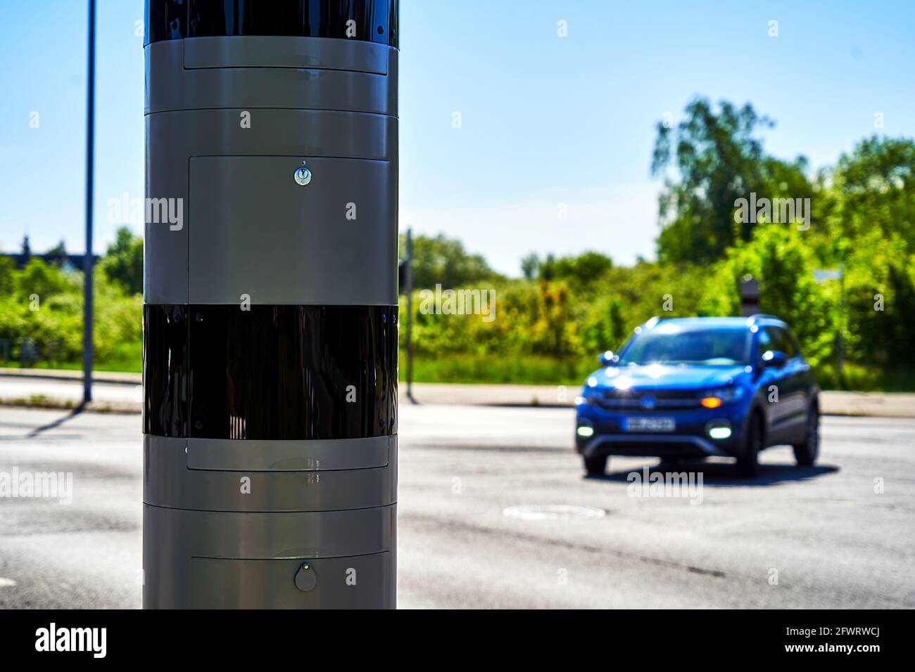 Stationary radar system measuring speed at an intersection in Germany ...