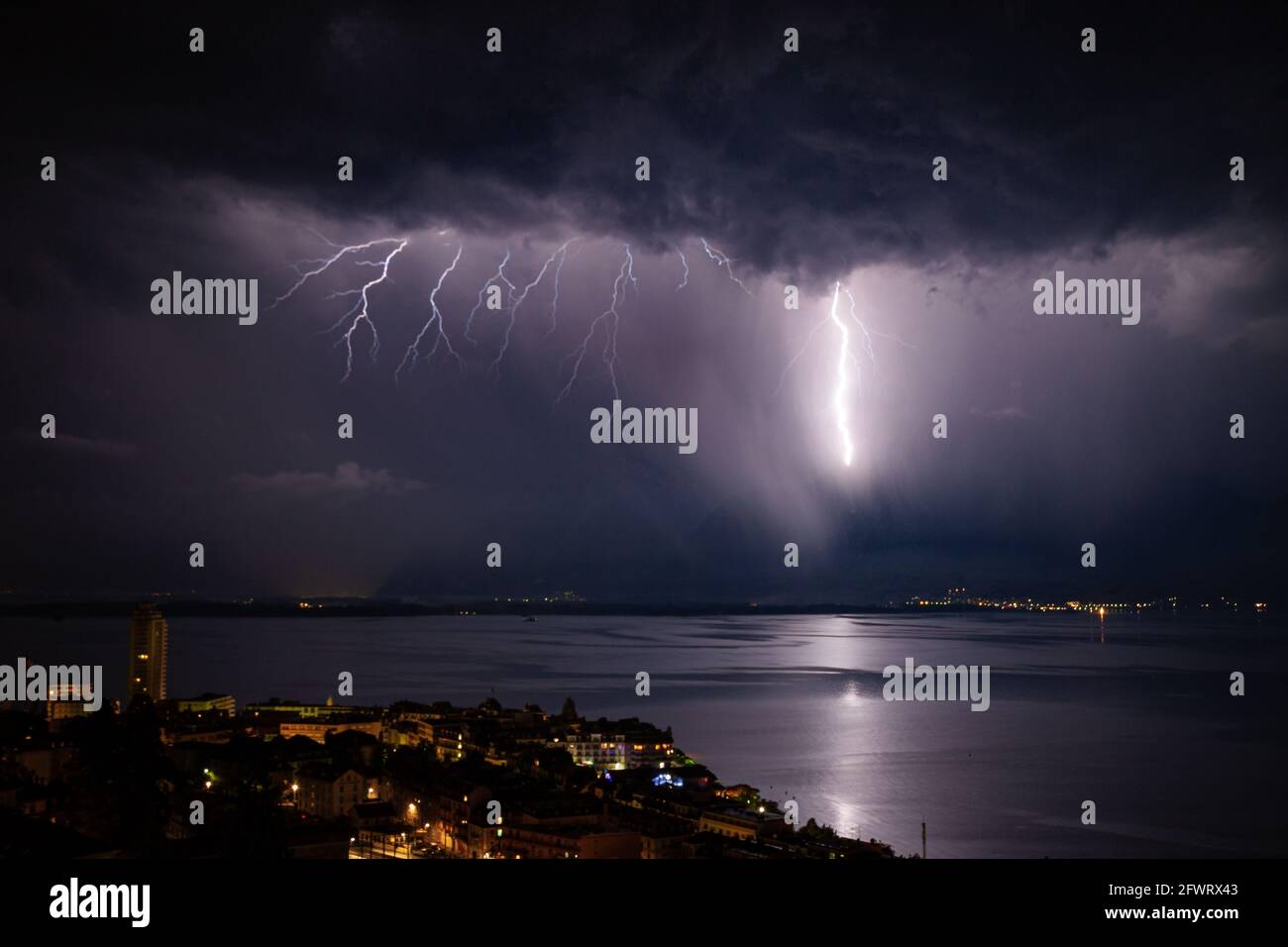 Rapturous thunder and lightning shines over Lake Geneva. SWITZERLAND ...