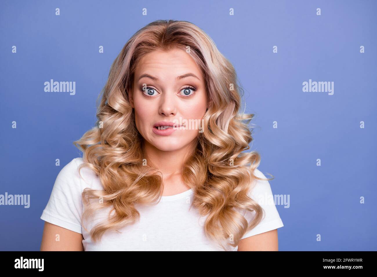 Photo of young unhappy upset sad worried scared anxious girl bite lips ...