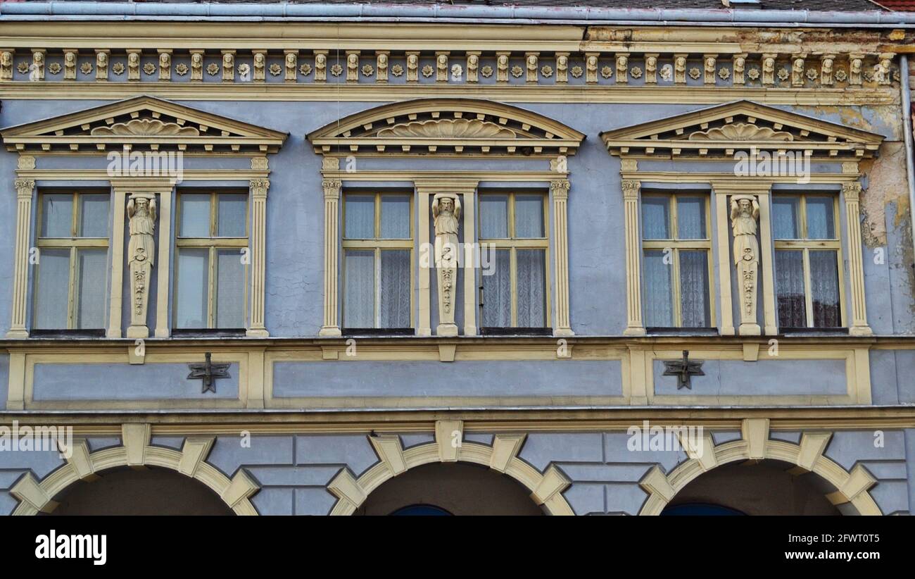 Facade of a grey medieval house on the main square in Jicin, Czech ...