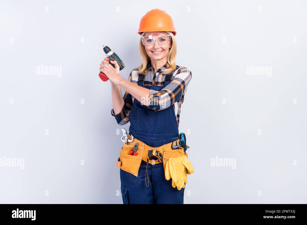 Photo of cheerful pretty age crafts lady dressed blue uniform smiling ...