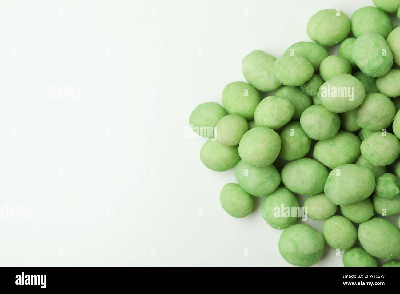 Group of tasty wasabi nuts on white background Stock Photo - Alamy