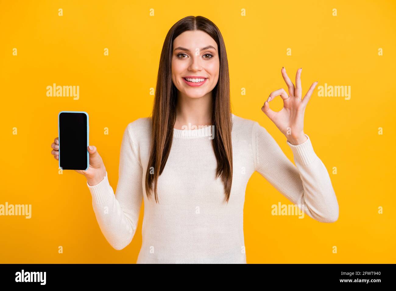 Photo of pretty positive lady fingers show okey symbol demonstrating ...