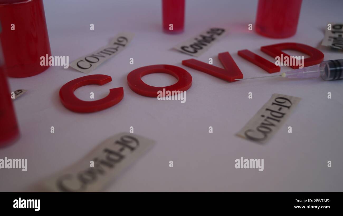 Covid - 19 concept with syringe and samples.The sample liquid used in ...