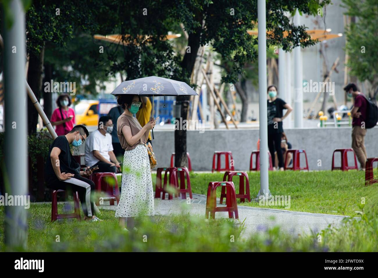 New Taipei, Taiwan. 24th May, 2021. People seen queuing at one of the ...