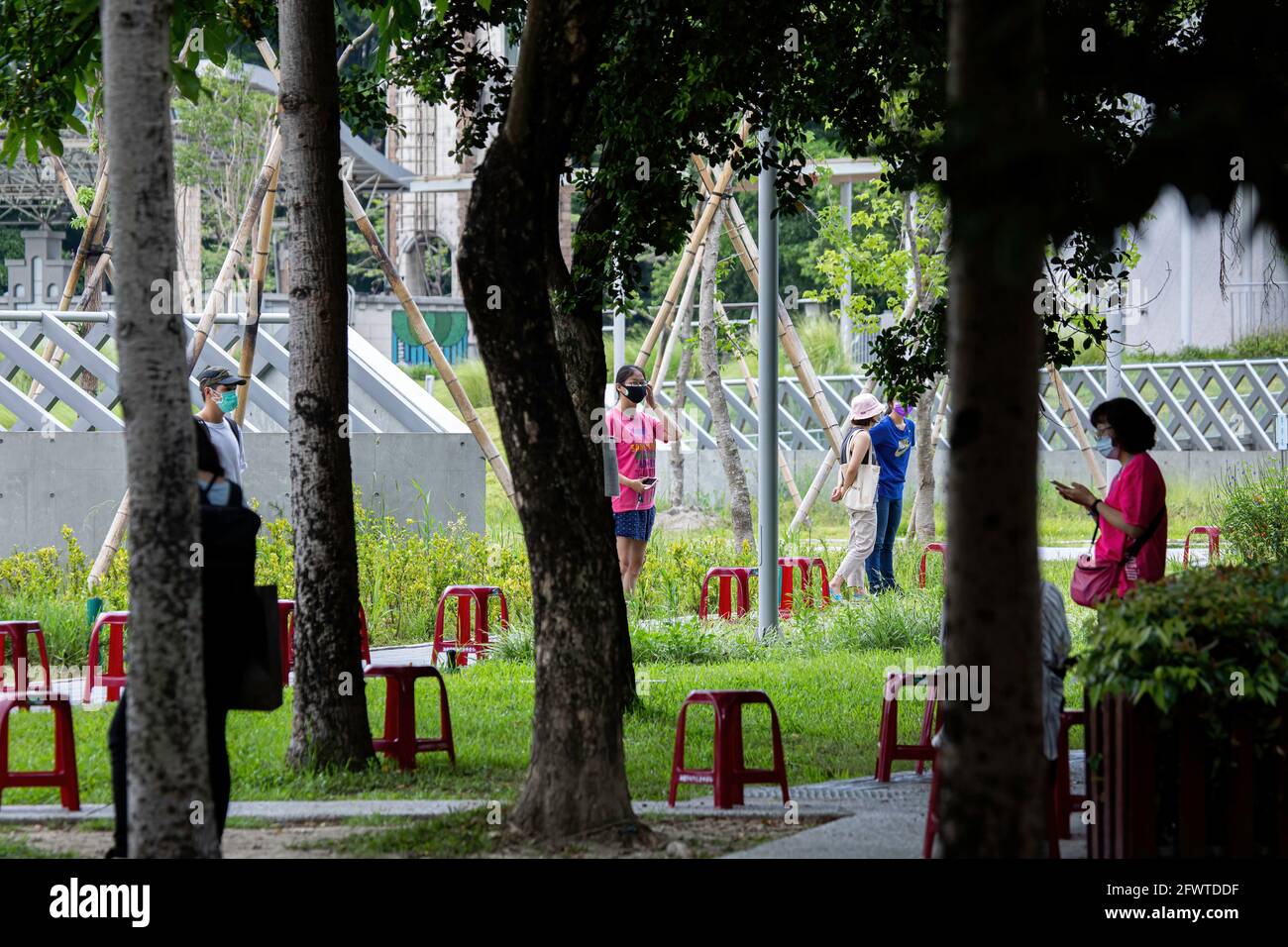 New Taipei, Taiwan. 24th May, 2021. People queuing at one of the rapid ...