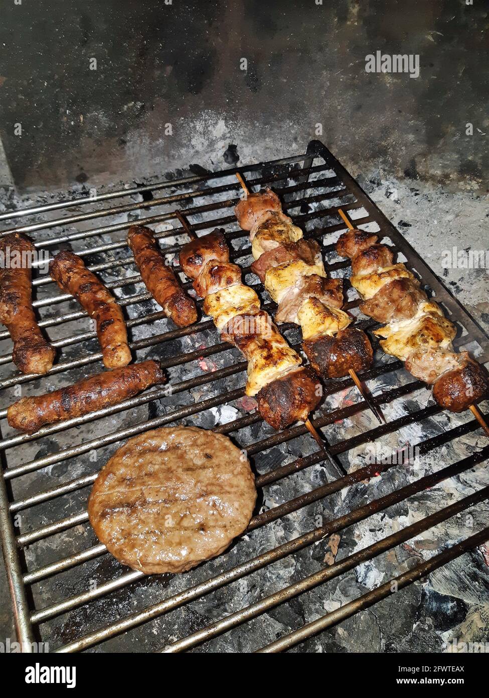 Grilled freshly cooked mixed meat Stock Photo - Alamy