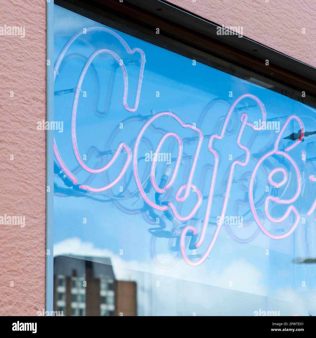 Illuminated Cafe sign with window reflections Stock Photo - Alamy