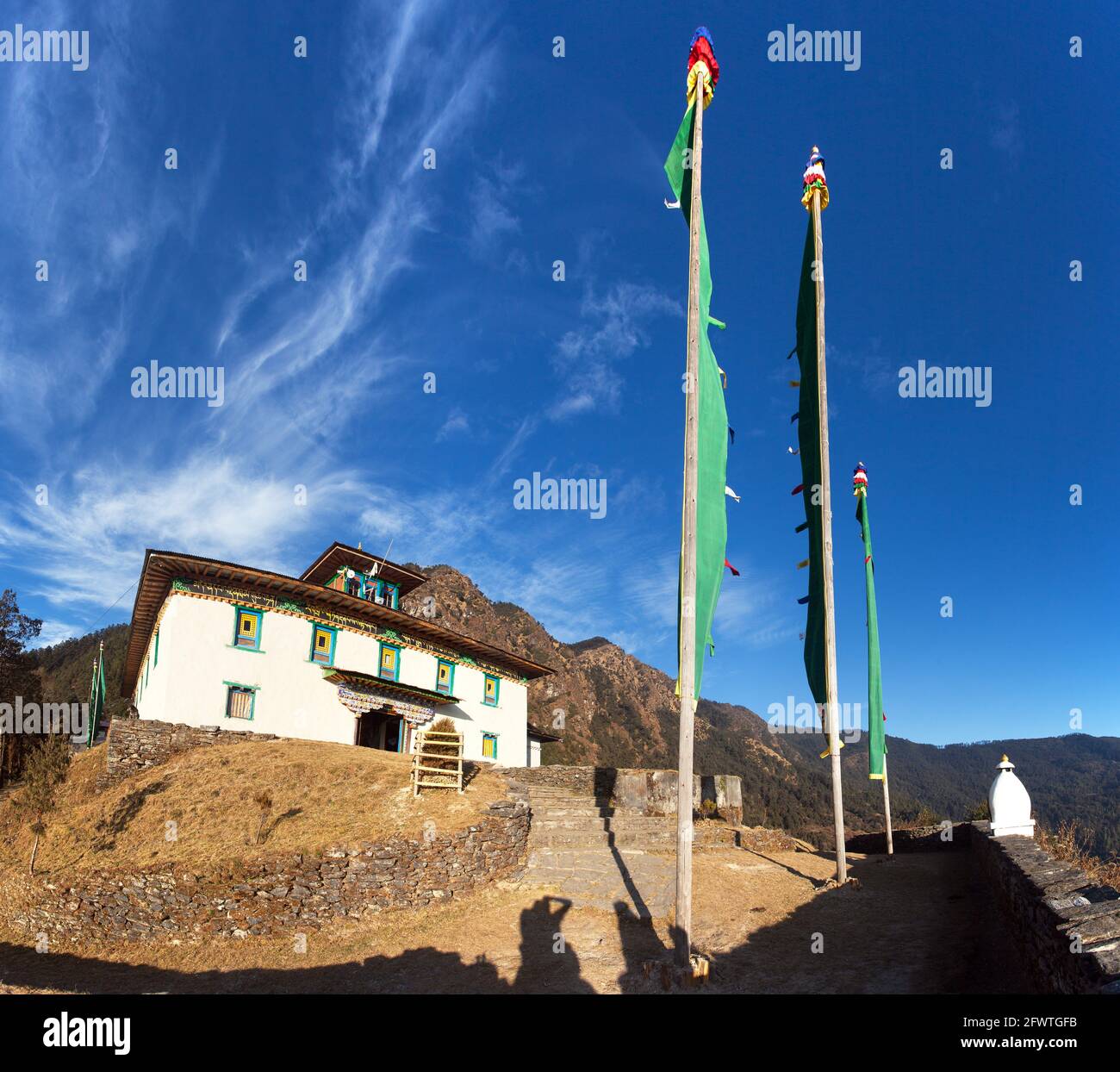 Buddhist monastery gompa or gumba in Chiwang village with prayer flafs ...