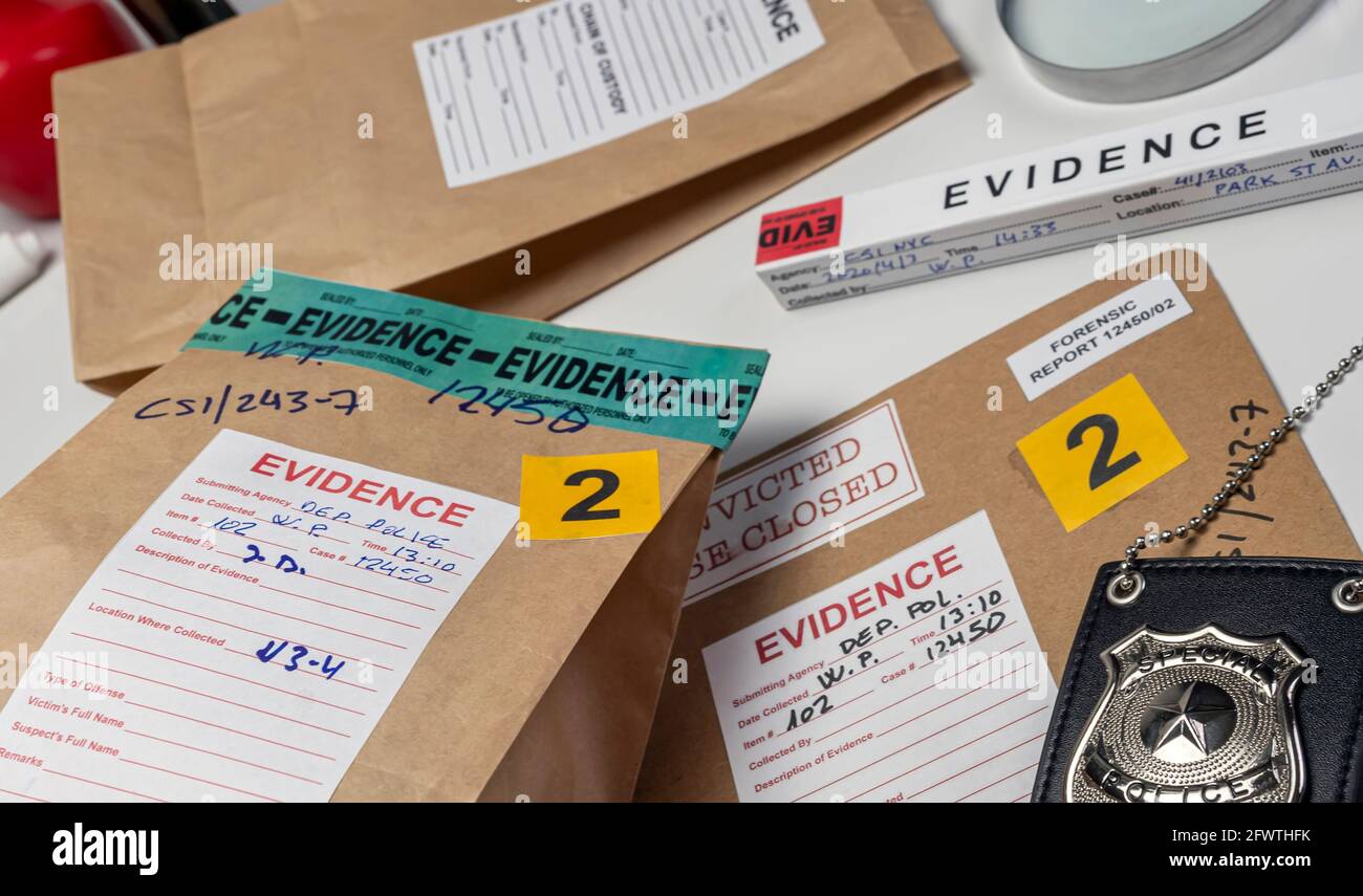 Files and evidence bag in a crime lab, conceptual image Stock Photo - Alamy