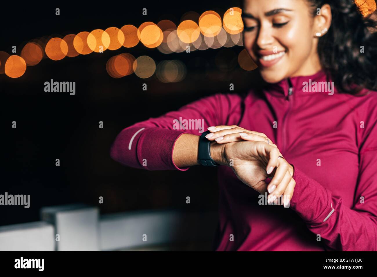 Close up of a sportswoman checking smartwatch on her wrist Stock Photo ...