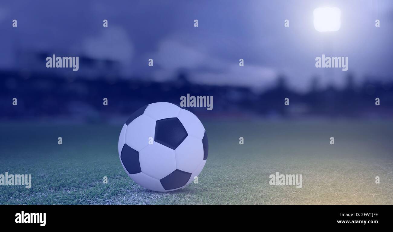 Composition of football lying on stadium over light blur Stock Photo ...