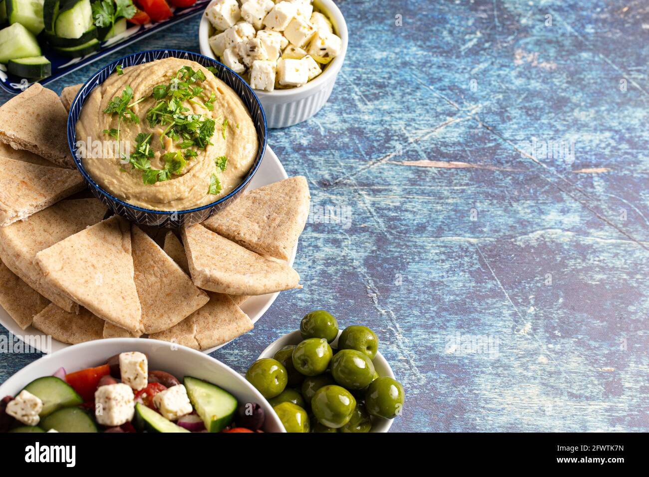 Fresh Greek Food on a Rustic Blue Wooden Background Stock Photo - Alamy