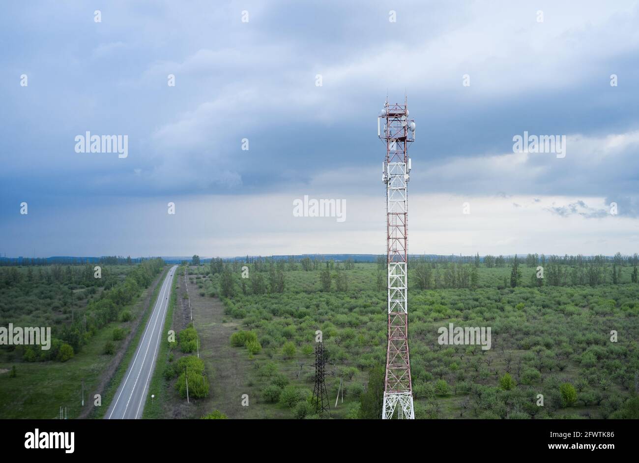 Communication tower with antennas against the background of rainy clouds Stock Photo - Alamy