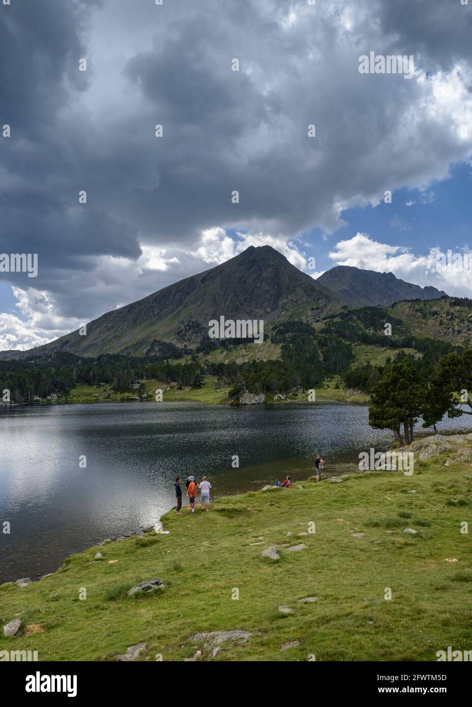 Pic Peric and Petit Peric summits seen from the Camporells lake and ...