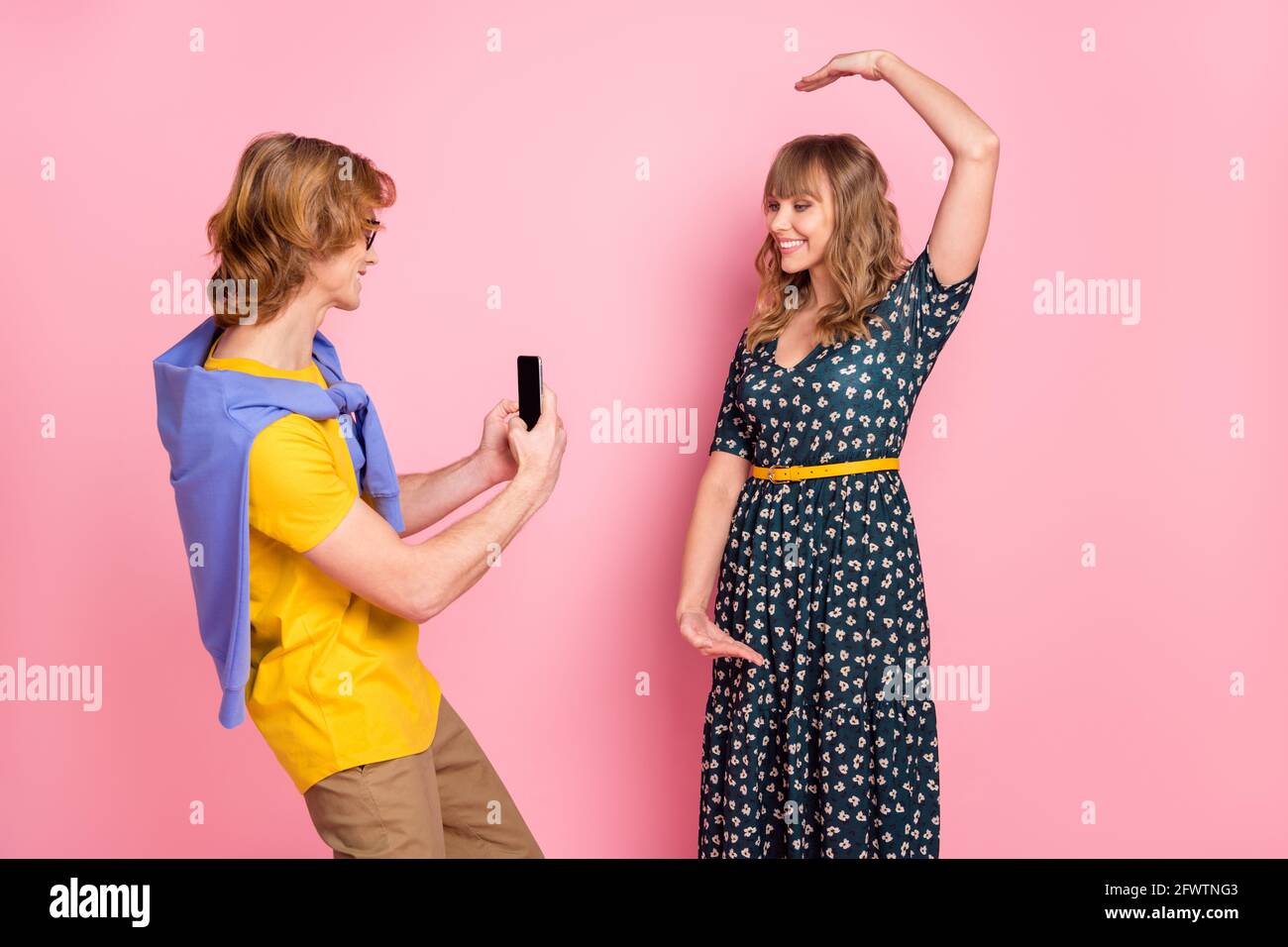 Portrait of attractive cheerful couple pretty girl posing guy taking ...